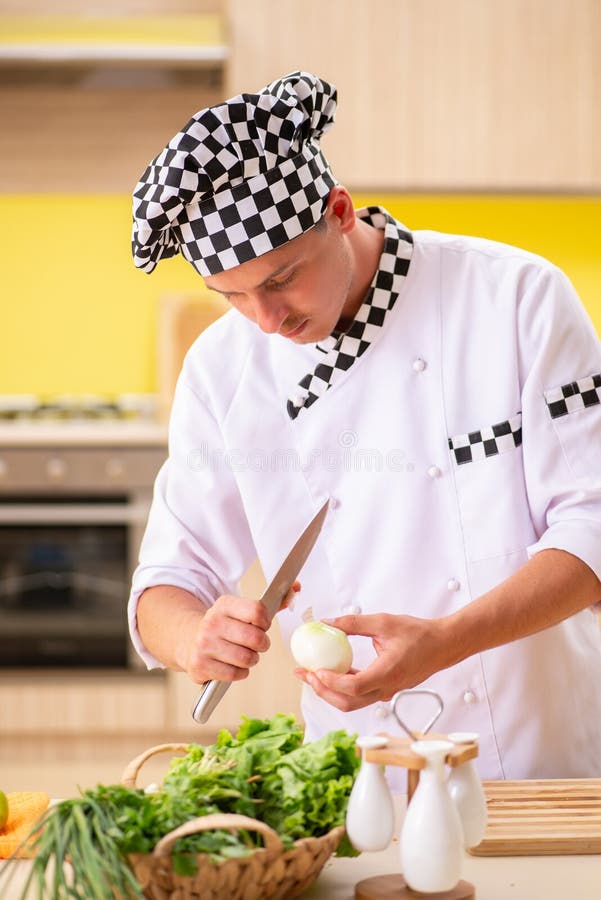 The Young Professional Cook Preparing Salad at Kitchen Stock Image ...