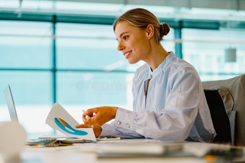 A Young Professional Engaging in Thorough Data Analysis within a ...