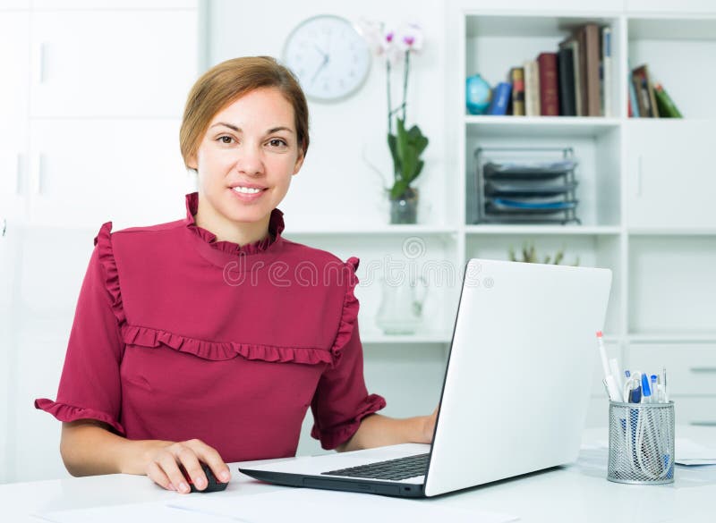 Young Professional Female Employee Typing on Portable Computer Stock ...