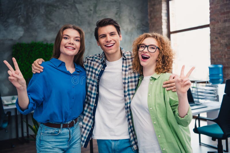 Young Professional Group Smiling in Office Setting Showcasing Teamwork ...