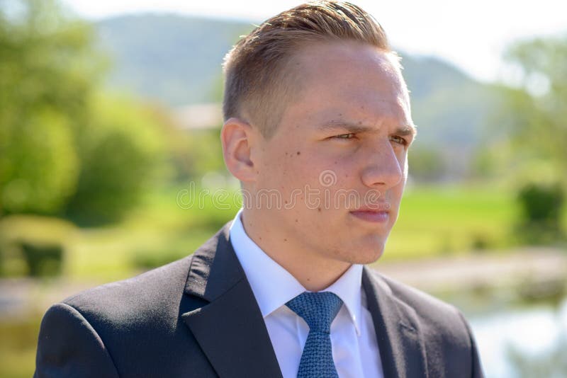 Young Professional Man Standing Thinking Deeply Stock Photo - Image of ...