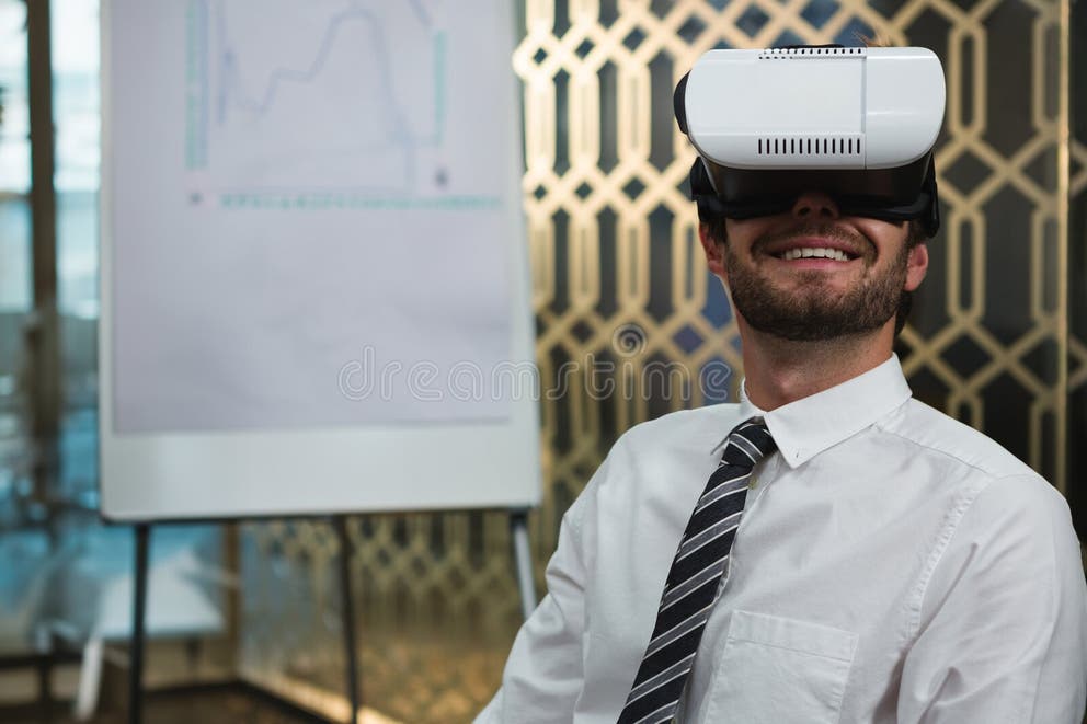 Young Professional Man Using Virtual Reality Headset in Office Room with Flip Chart and ...