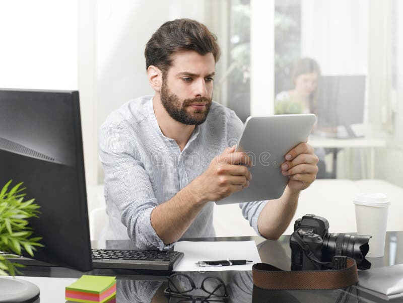 Young Professional at Office Stock Image - Image of occupation, looking ...