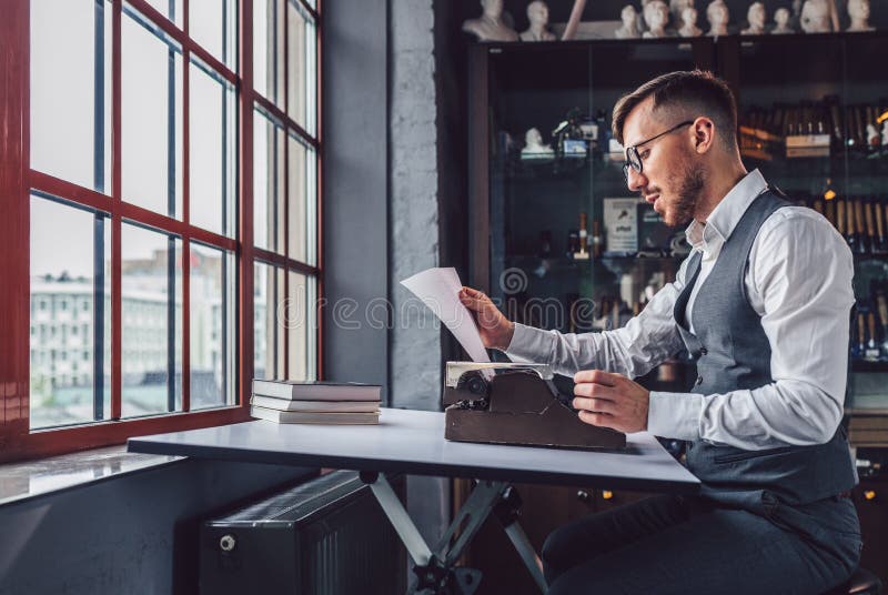 Young Professional with a Retro Typewriter Stock Photo - Image of ...