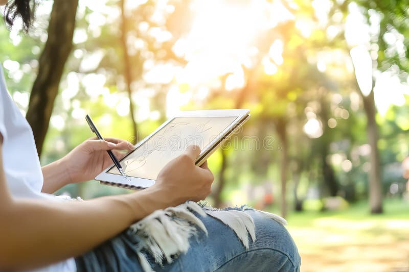 Young Professional Sketching App Design on Tablet, Sitting in Sunny ...