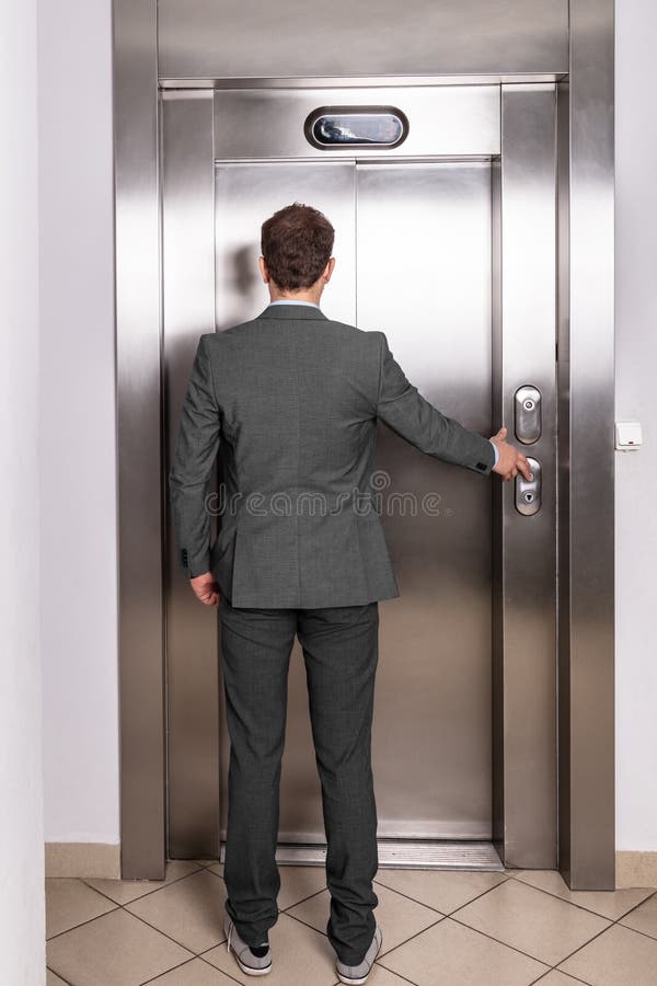 Young Professional in Suit Waiting in Front of the Elevator Stock Image ...