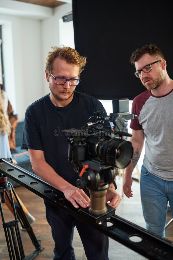 Young Professional Videographer Moving Video Camera Along Slider Stock ...