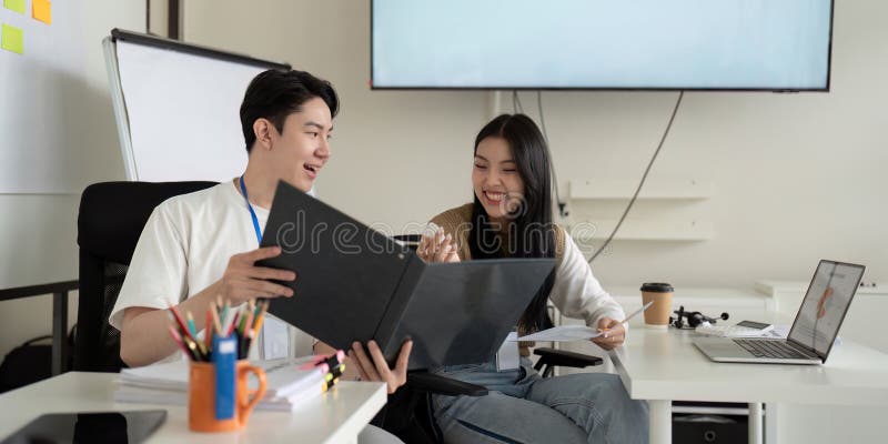 Young Professionals Collaborating on Financial Analysis in a Modern ...