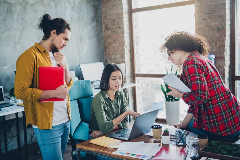 Young Professionals Collaborating in a Modern Workspace, Focusing on ...