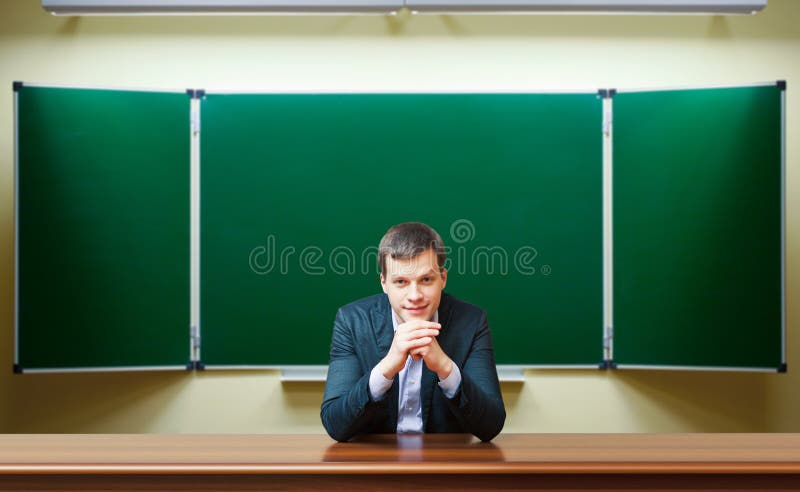 Young Professor Lecturer with Microphone Speaking and Teaching Students ...