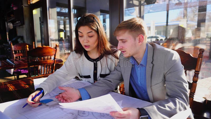 Young Professor Helping Student with Architect Draft. Stock Video ...
