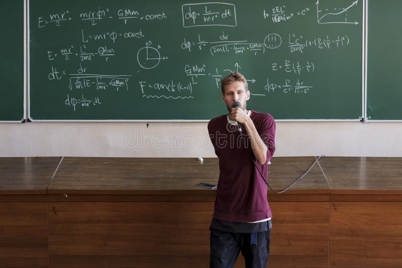 Young Professor Lecturer with Microphone Speaking and Teaching Students ...