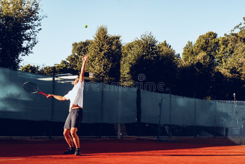 Young Proffesional Tennis Player Doing a Serve Stock Photo - Image of ...