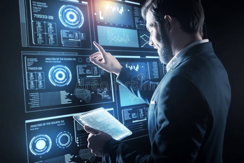 Young Programmer Looking at Tablet while Working with Futuristic ...