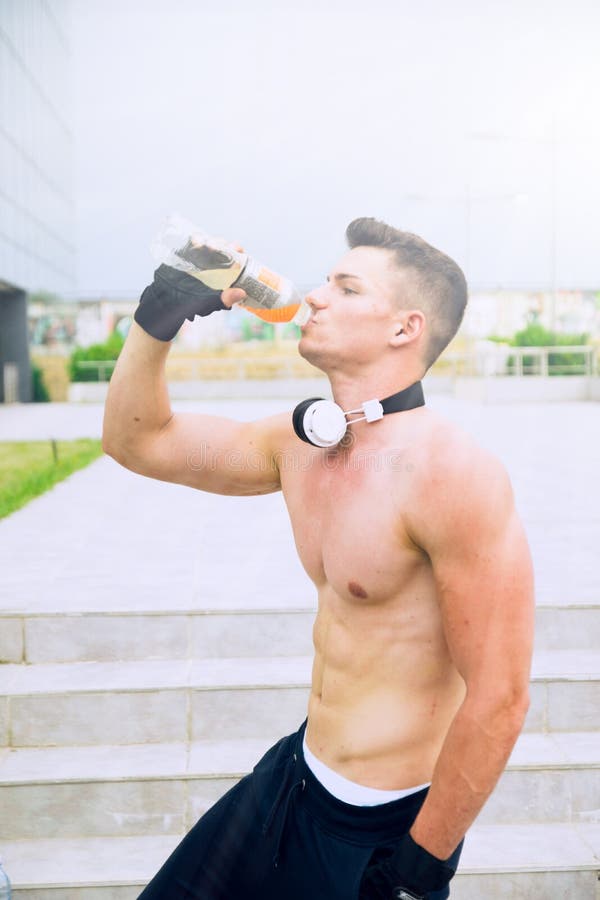 Young Proud Man Drinks Energizing Water after Very Hard Training Stock ...
