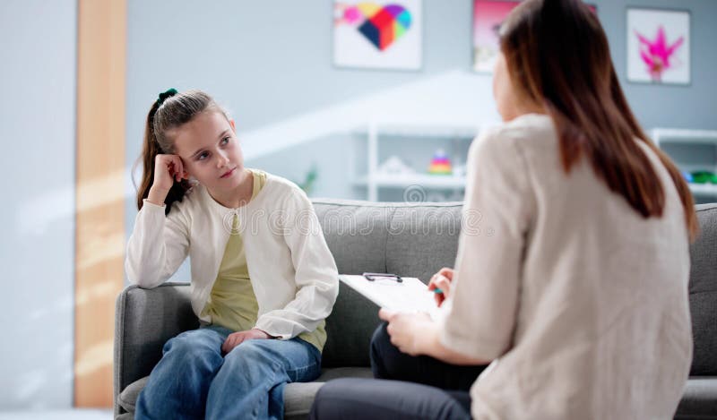 Young Psychiatrist Comforts a Sad ADHD Child during Stock Photo - Image ...