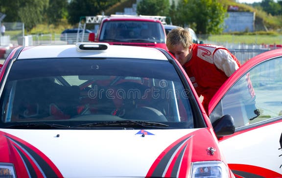 Young Rallye Driver is Checking His Car Stock Photo - Image of driver ...