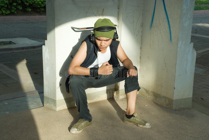Suburban Rapper Sitting on Street Stock Photo - Image of pose, gangsta ...