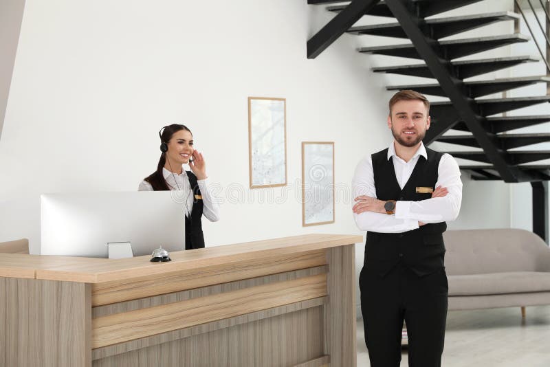 Young Receptionists in Professional Uniform Stock Photo - Image of ...
