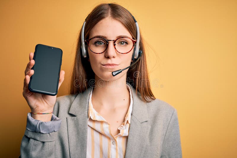 Young Redhead Call Center Agent Woman Using Headset Holding Showing ...