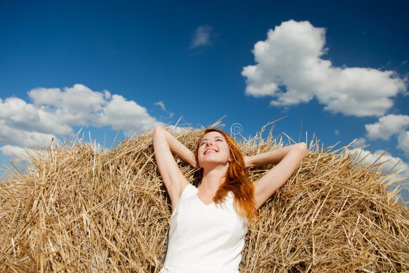Young Redhead Girl Lying Down at Hay Stock Image - Image of countryside ...