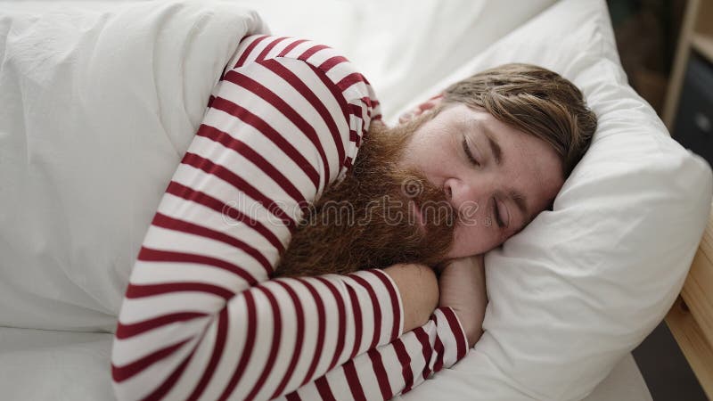 Young Redhead Man Lying on Bed Sleeping at Bedroom Stock Photo - Image ...