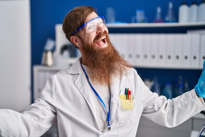 Young Redhead Man Scientist Smiling Confident Speaking at Laboratory ...