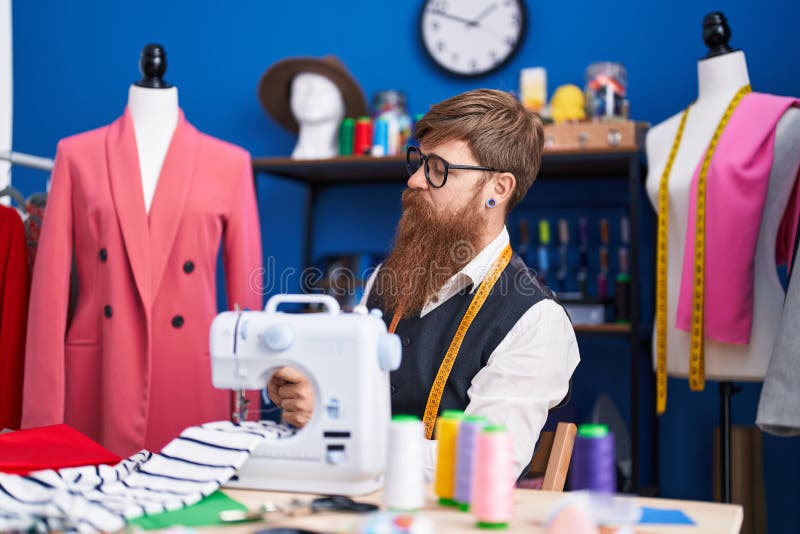 Young Redhead Man Tailor Using Sewing Machine at Clothing Factory Stock ...
