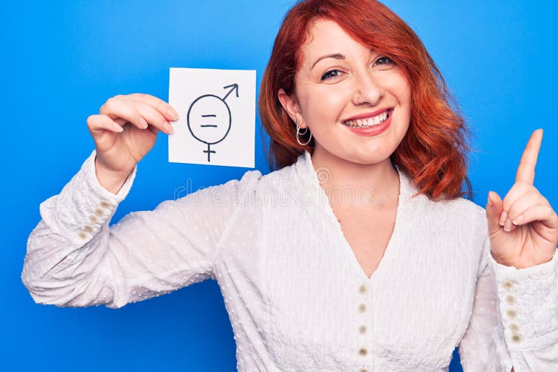 Young Redhead Woman Asking For Sex Discrimination Holding Paper With