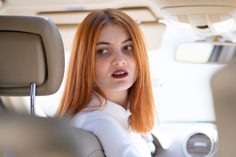 Young Redhead Woman Driver Driving a Car Backwards Stock Photo - Image ...