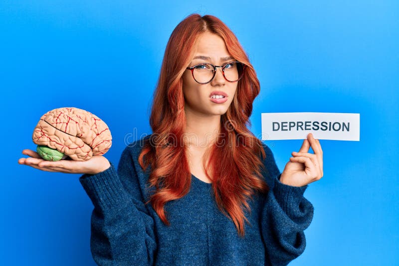 Young Redhead Woman Holding Brain and Depression Text Clueless and ...