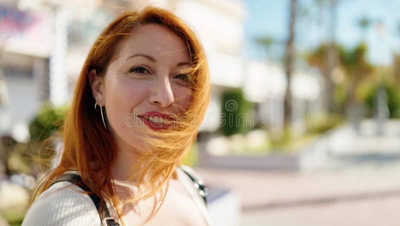 Young Redhead Woman Smiling Confident Standing at Park Stock Photo ...