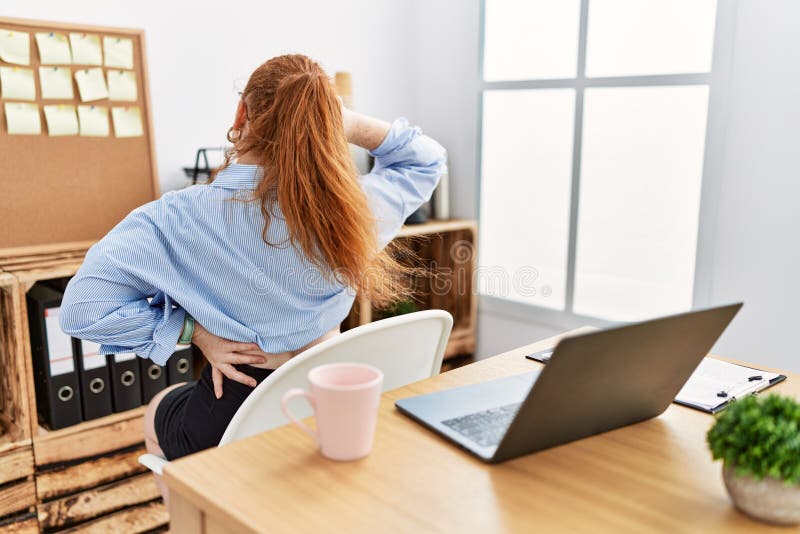 Young Redhead Woman Working at the Office Using Computer Laptop ...