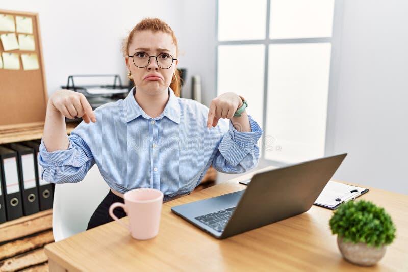 Young Redhead Woman Working at the Office Using Computer Laptop ...