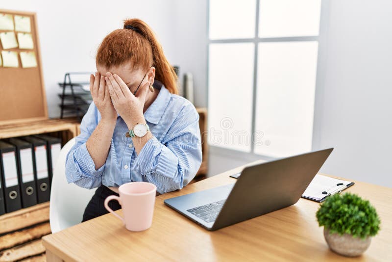 Young Redhead Woman Working at the Office Using Computer Laptop with ...