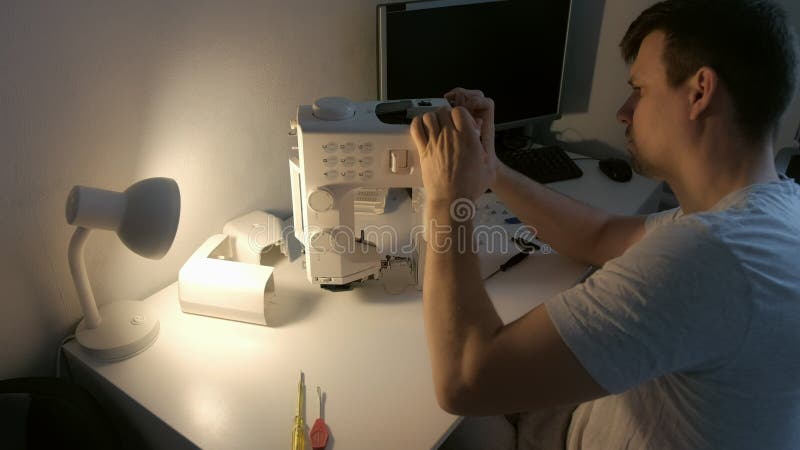 Repairman Unscrewing Body of Sewing Machine Using Screwdriver Repairing ...