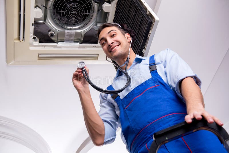 Young Repairman Repairing Ceiling Air Conditioning Unit Stock Image ...