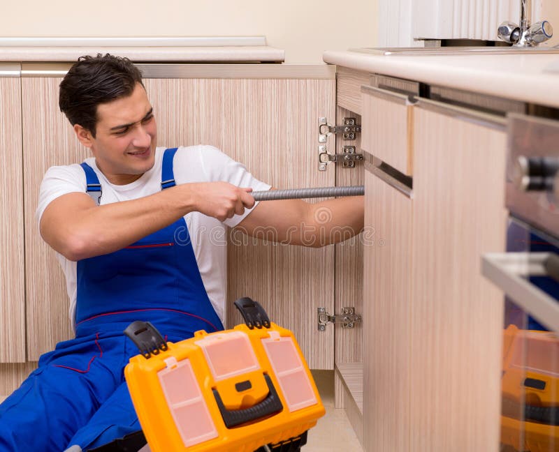 Young Repairman Working at the Kitchen Stock Photo - Image of builder ...