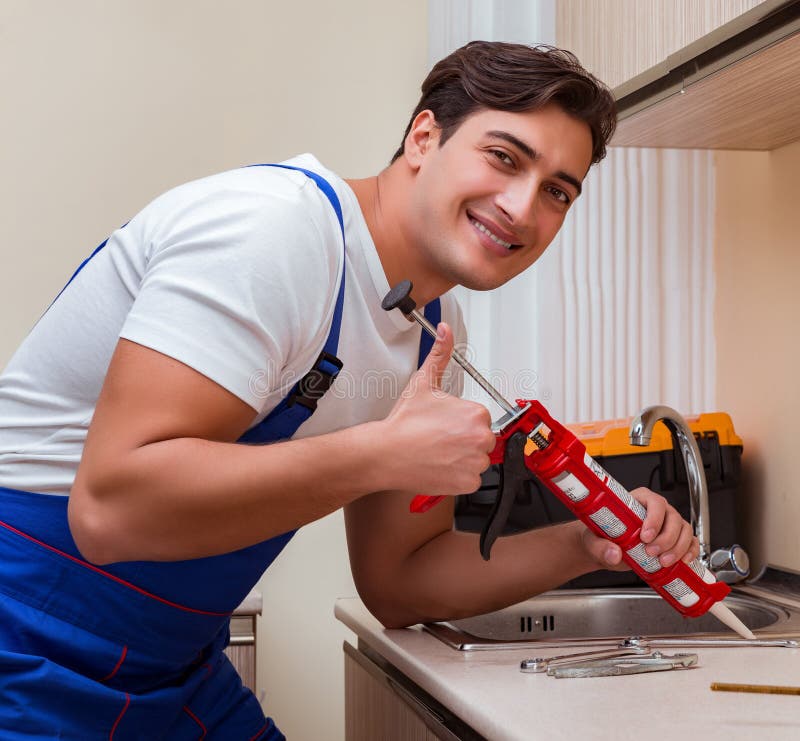 Young Repairman Working at the Kitchen Stock Image - Image of ...
