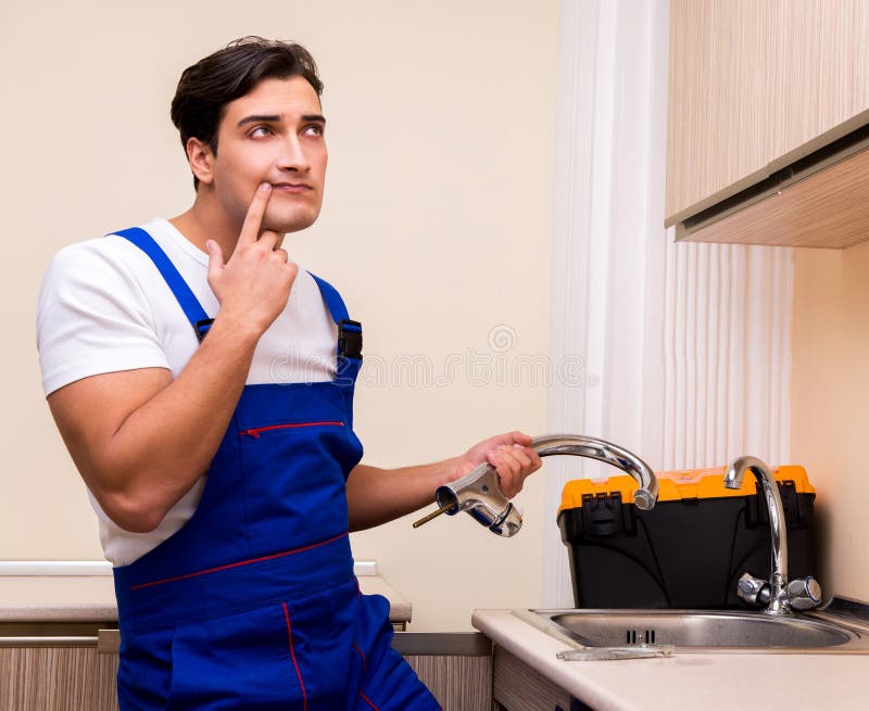 Young Repairman Working at the Kitchen Stock Image - Image of repairman ...