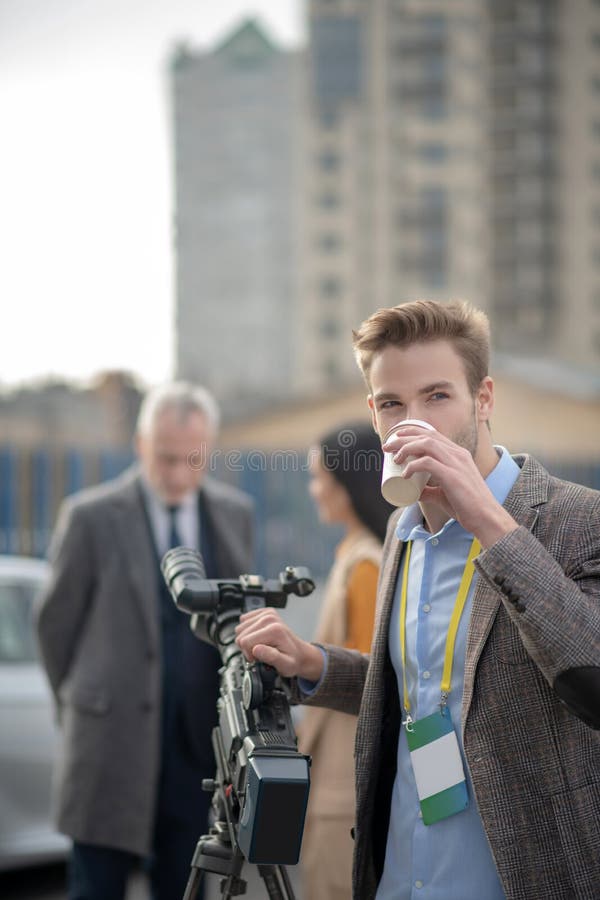 Young Reporter Having Coffee during Break in Work Stock Photo - Image ...
