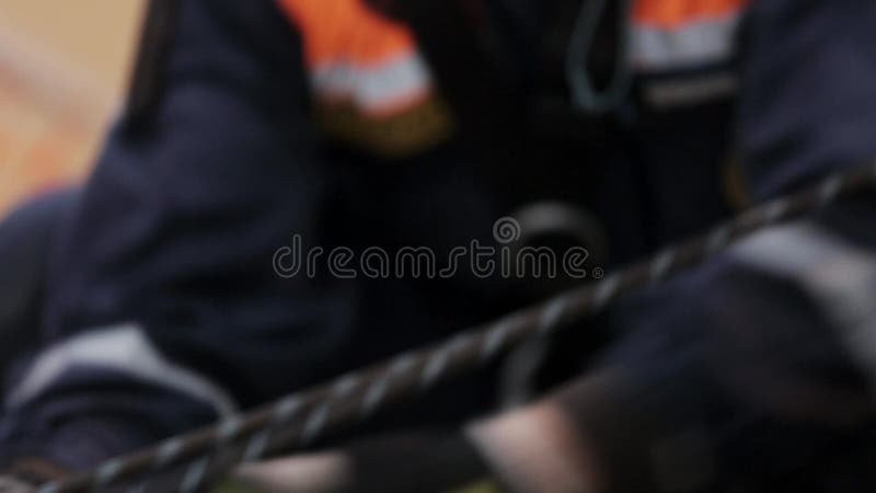 Young Rescuer in Helmet, Equipment, Mask Pulls a Rope. Emercom Training ...