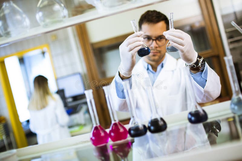 Researcher Checking His Mobile Stock Photo - Image of keyboard, optics ...