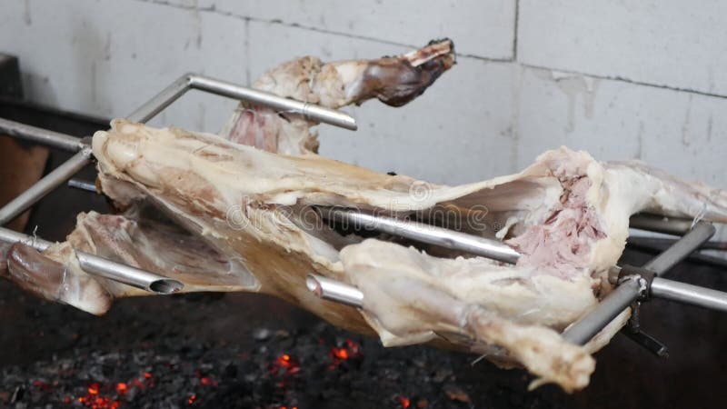 Young Roast Goat with Automatic Rotating Machine Stock Footage - Video ...
