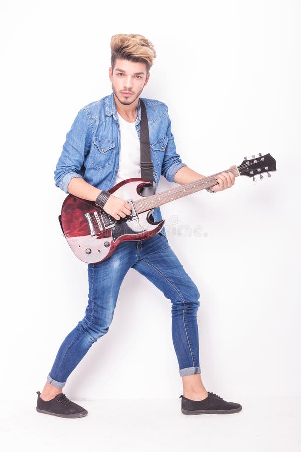 Handsome Rocker Holding His Electric Guitar on His Shoulder Stock Image ...