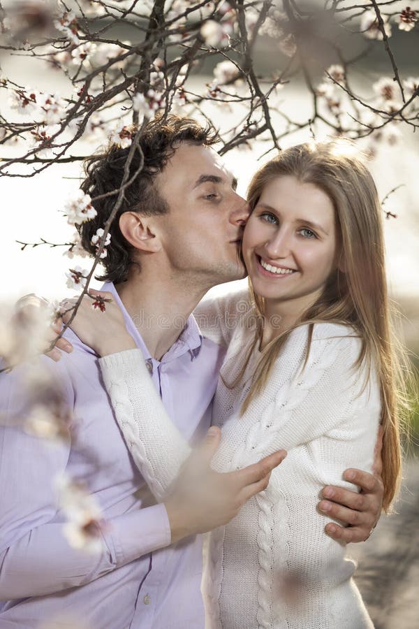Young Romantic Couple in Spring Blossom Stock Photo - Image of ...