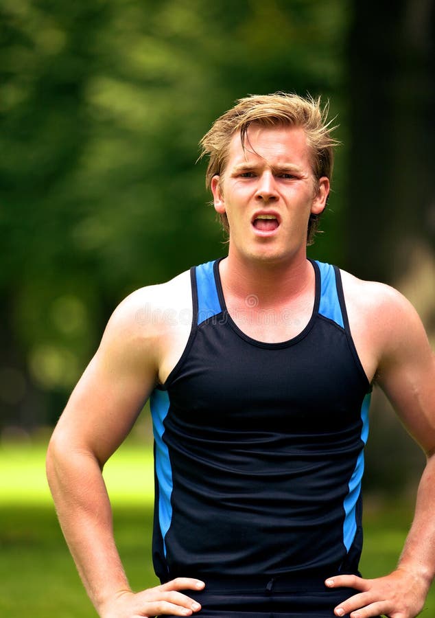 Young Runner Looking Exhausted Stock Image - Image of runner, masculine ...