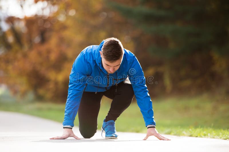 Young Runner in Park on Asphalt Path in Steady Position Stock Image ...