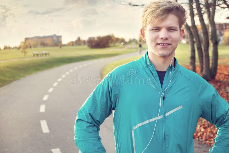 Young Runner Portrait in Autumn Park Stock Image - Image of male, road ...