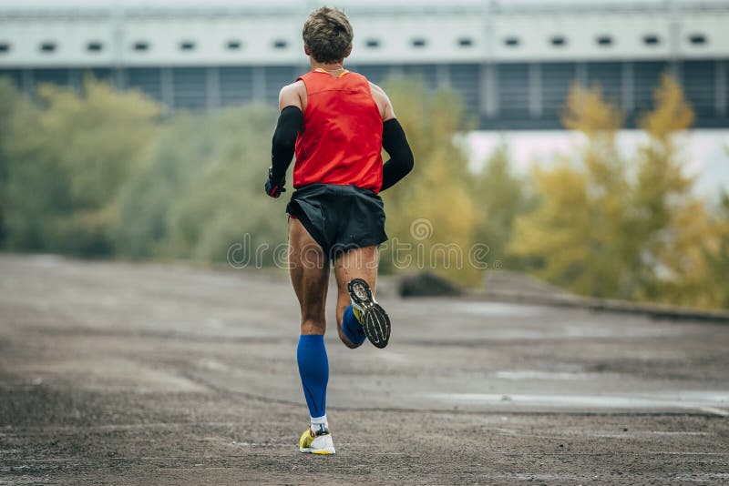 Young Runner Running Across Street Editorial Photography - Image of ...